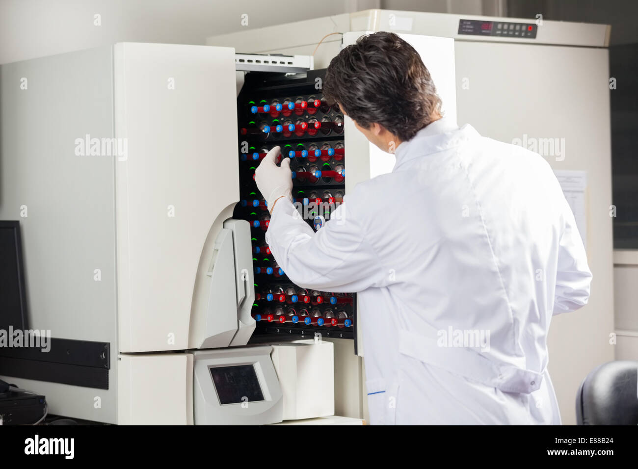 Microbiologist Placing Bottles Into Blood Culture Instrument Stock ...