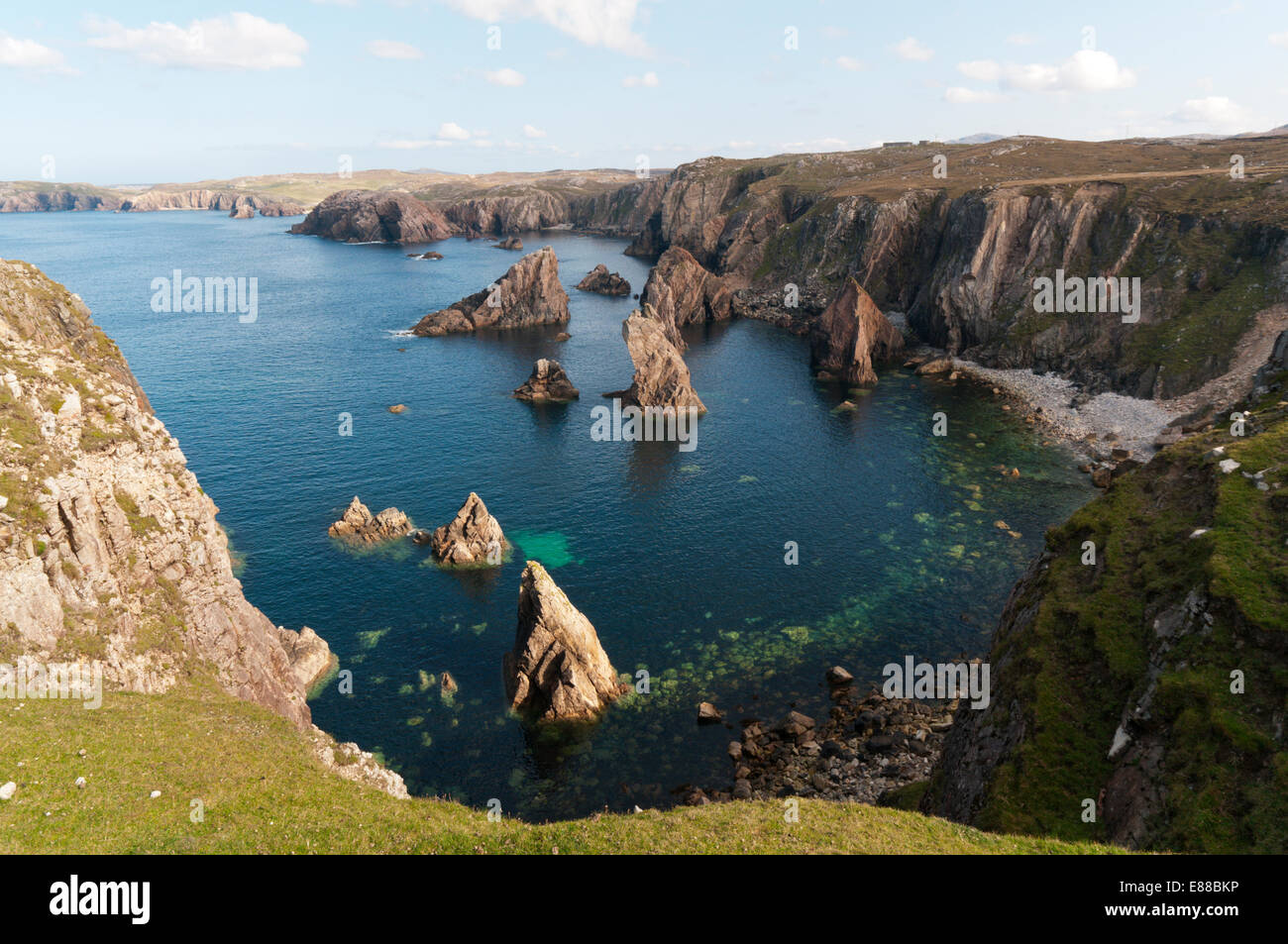 Sea stacks of hard, pink granite off the west coast of the Isle of ...