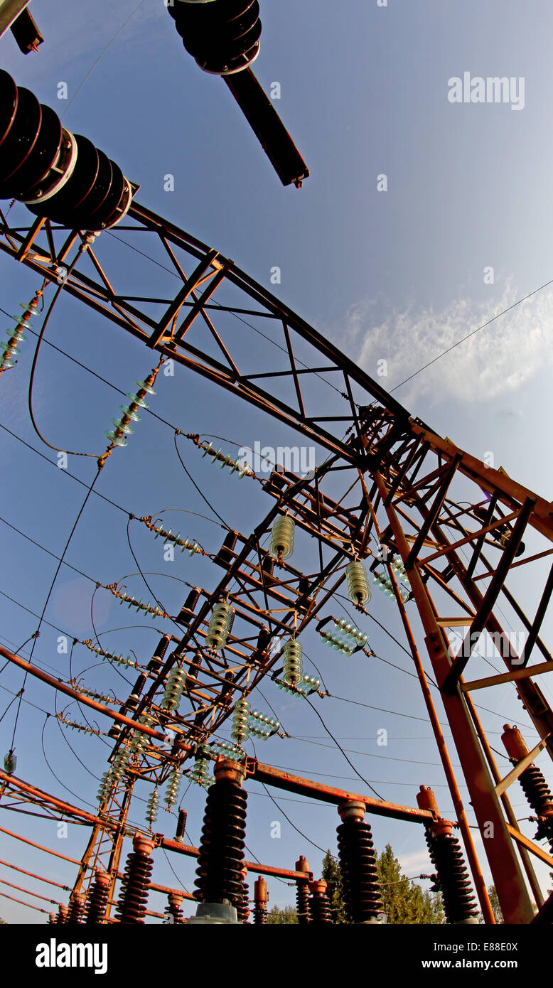 great insulators and electric cables in a large power plant with tall ...