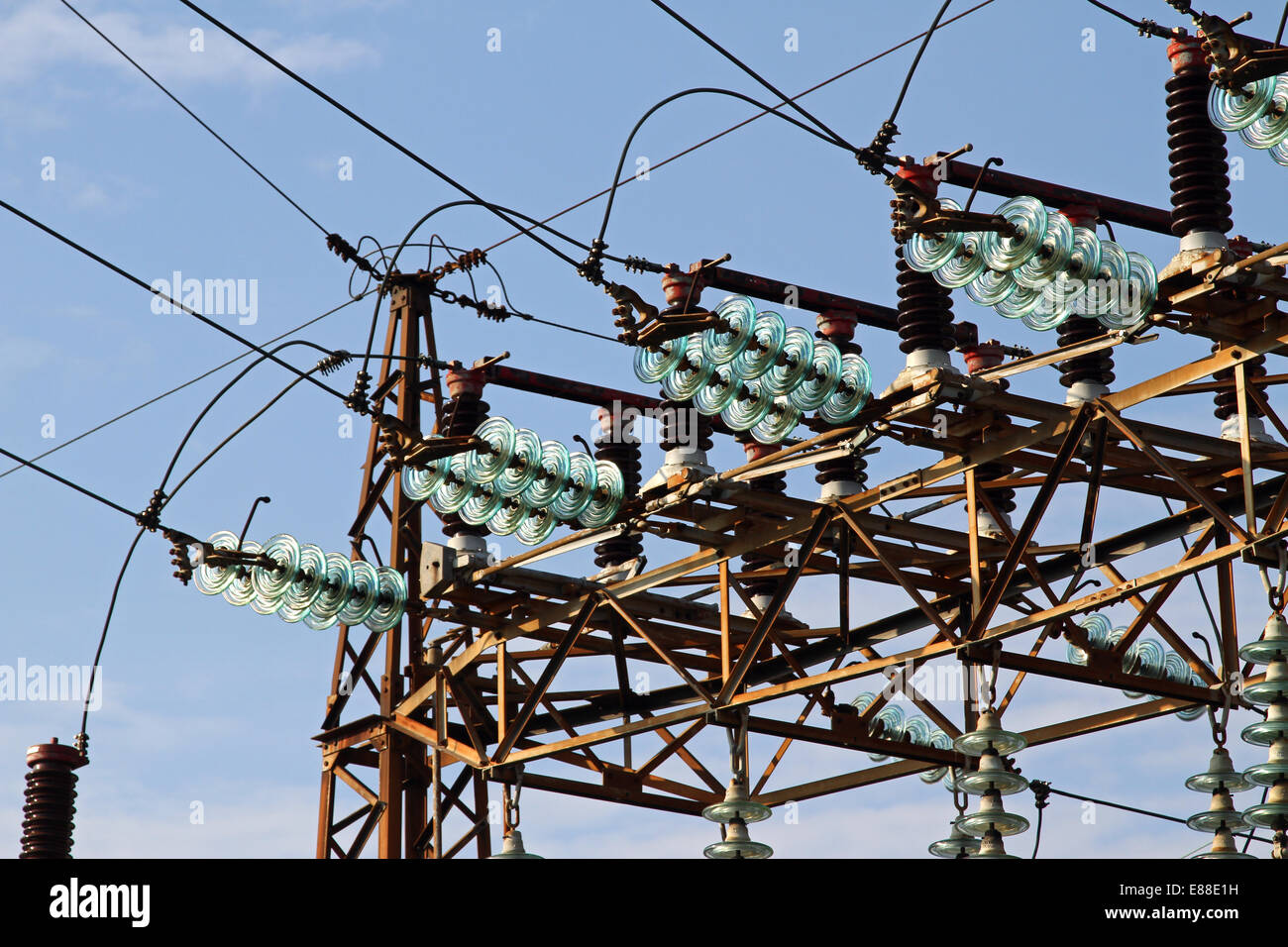 great insulators and electric cables in a large power plant with tall ...