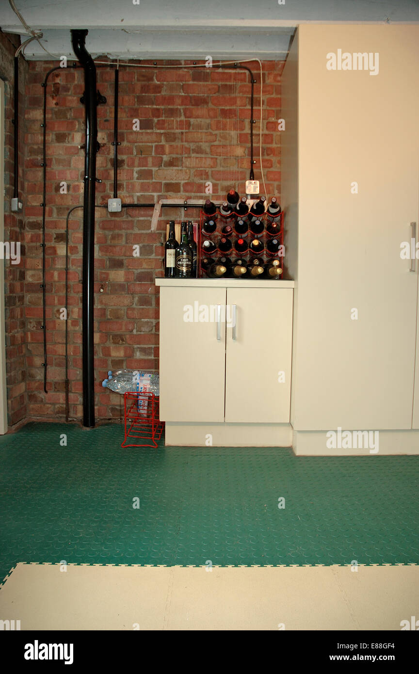 Wine storage on cupboard in garage Stock Photo - Alamy