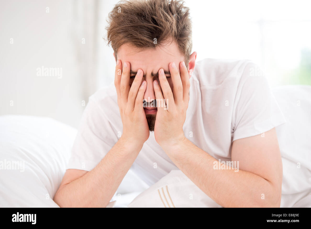 Sleepy young man Stock Photo - Alamy