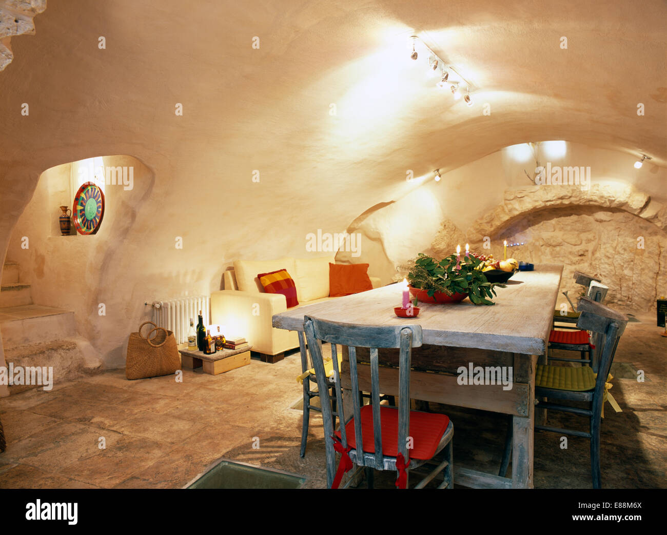 Long wooden table in Italian basement kitchen with arched ceiling Stock ...