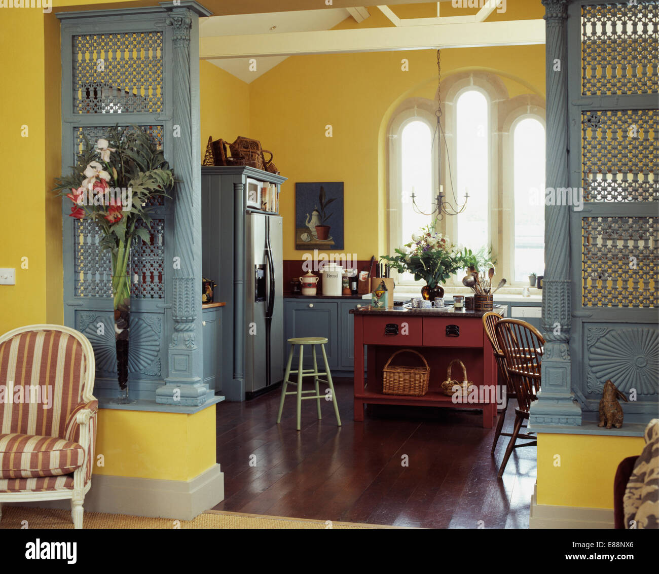 Blue Indian-style fretwork dividers on either side of doorway to yellow ...
