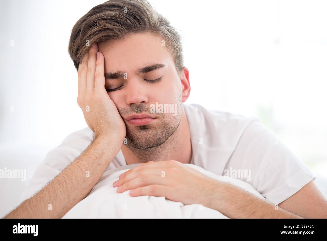 Sleepy young man Stock Photo - Alamy