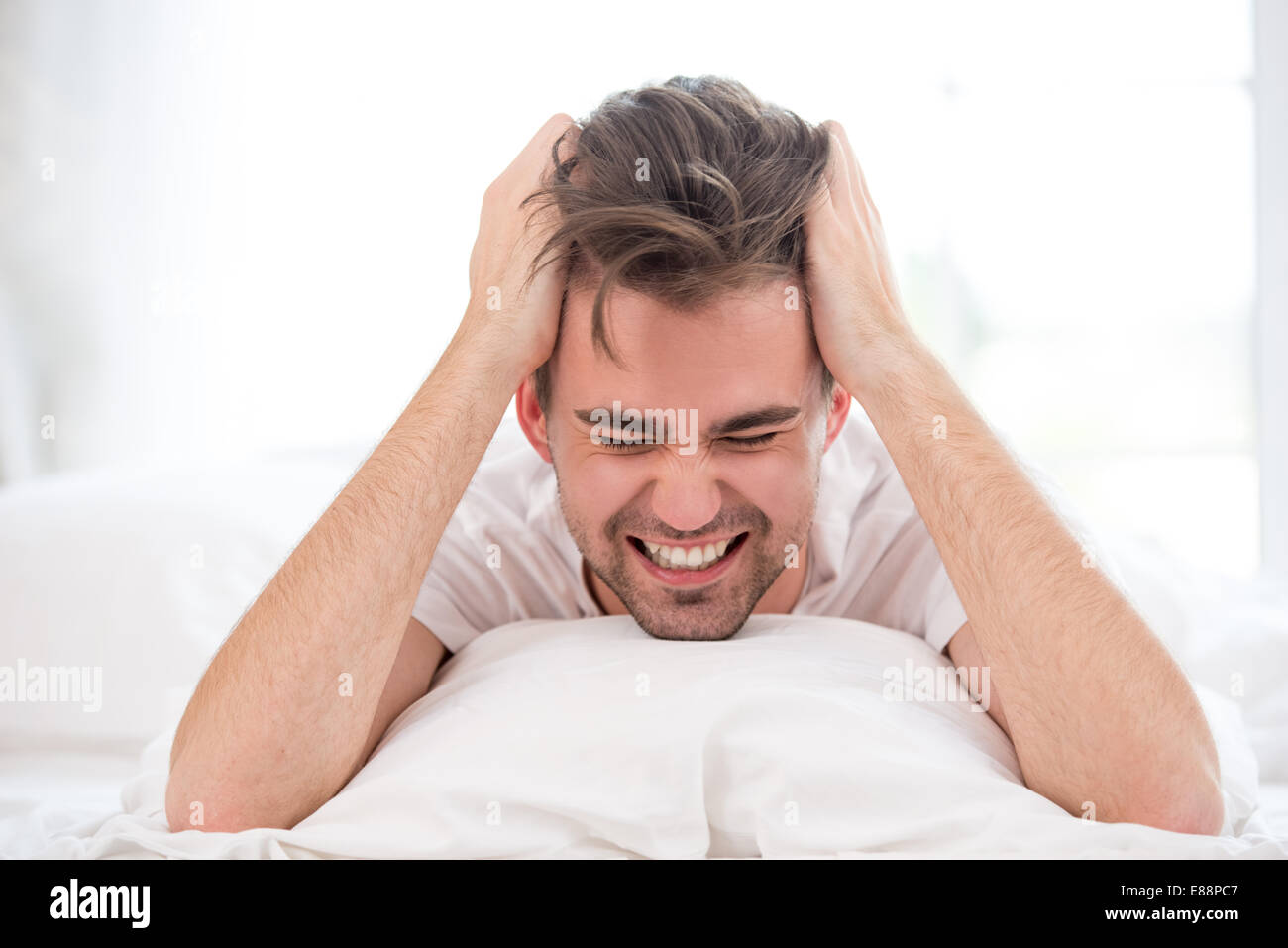 Angry sleepy young man Stock Photo - Alamy