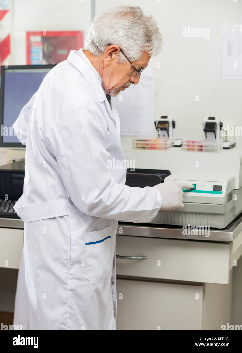 Scientist Analyzing Samples Using Analyzer Stock Photo - Alamy