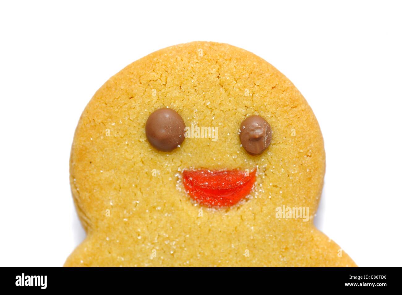Gingerbread man face close up on a white studio background Stock Photo ...