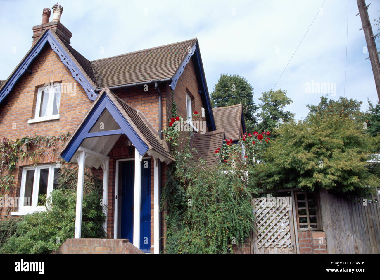Traditional Victorian brick-built house with blue painted barge ...