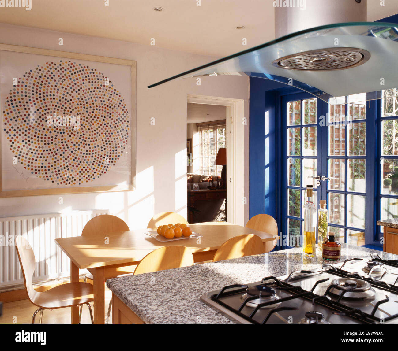 Large extractor above hob in island unit in modern kitchen dining room ...