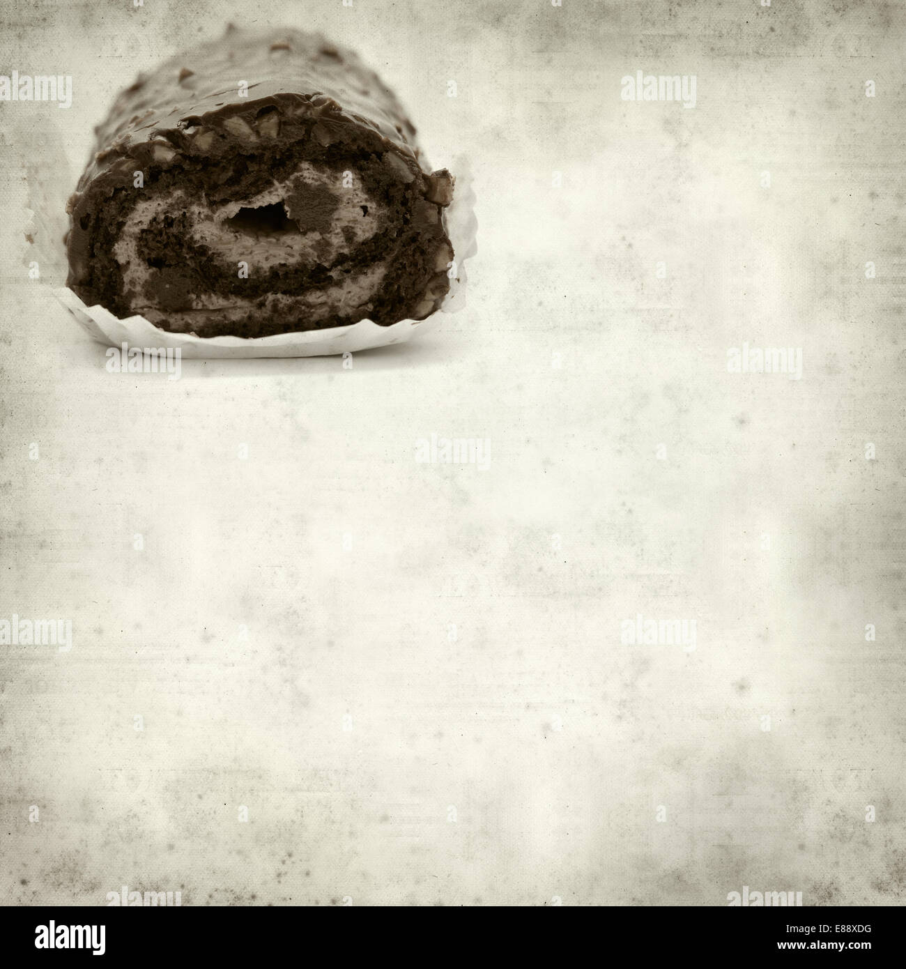 textured old paper background with chocolate roll cake Stock Photo - Alamy