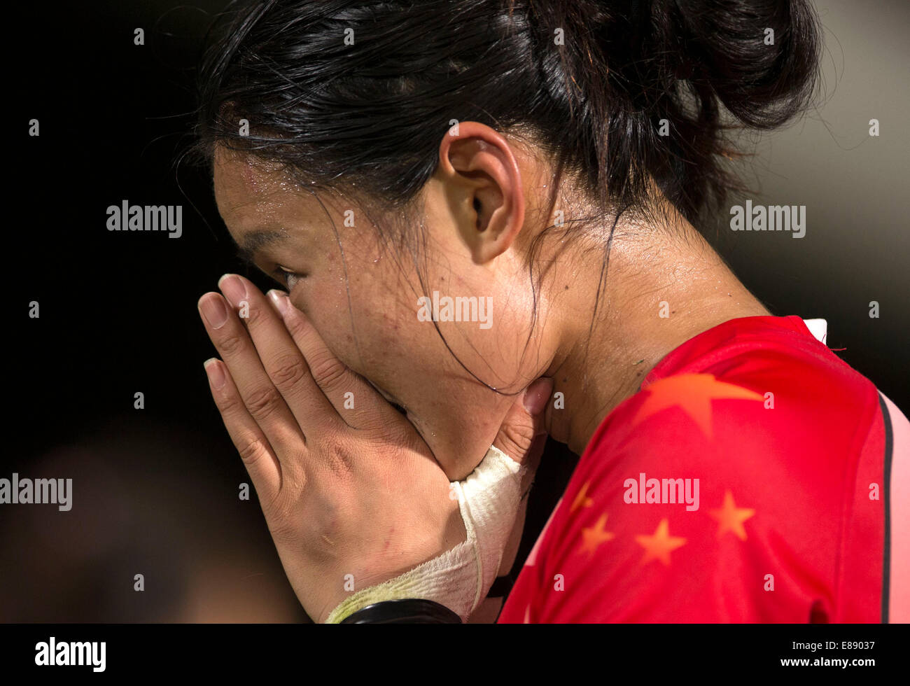 Incheon, South Korea. 2nd Oct, 2014. Guan Qishi of China sheds tears ...