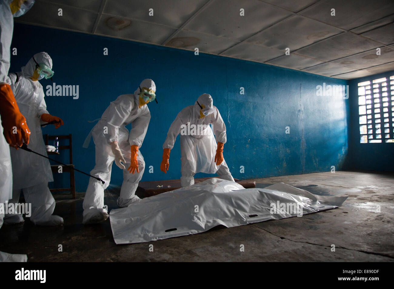 Body removal team preps a body to be removed from the West Pont ...
