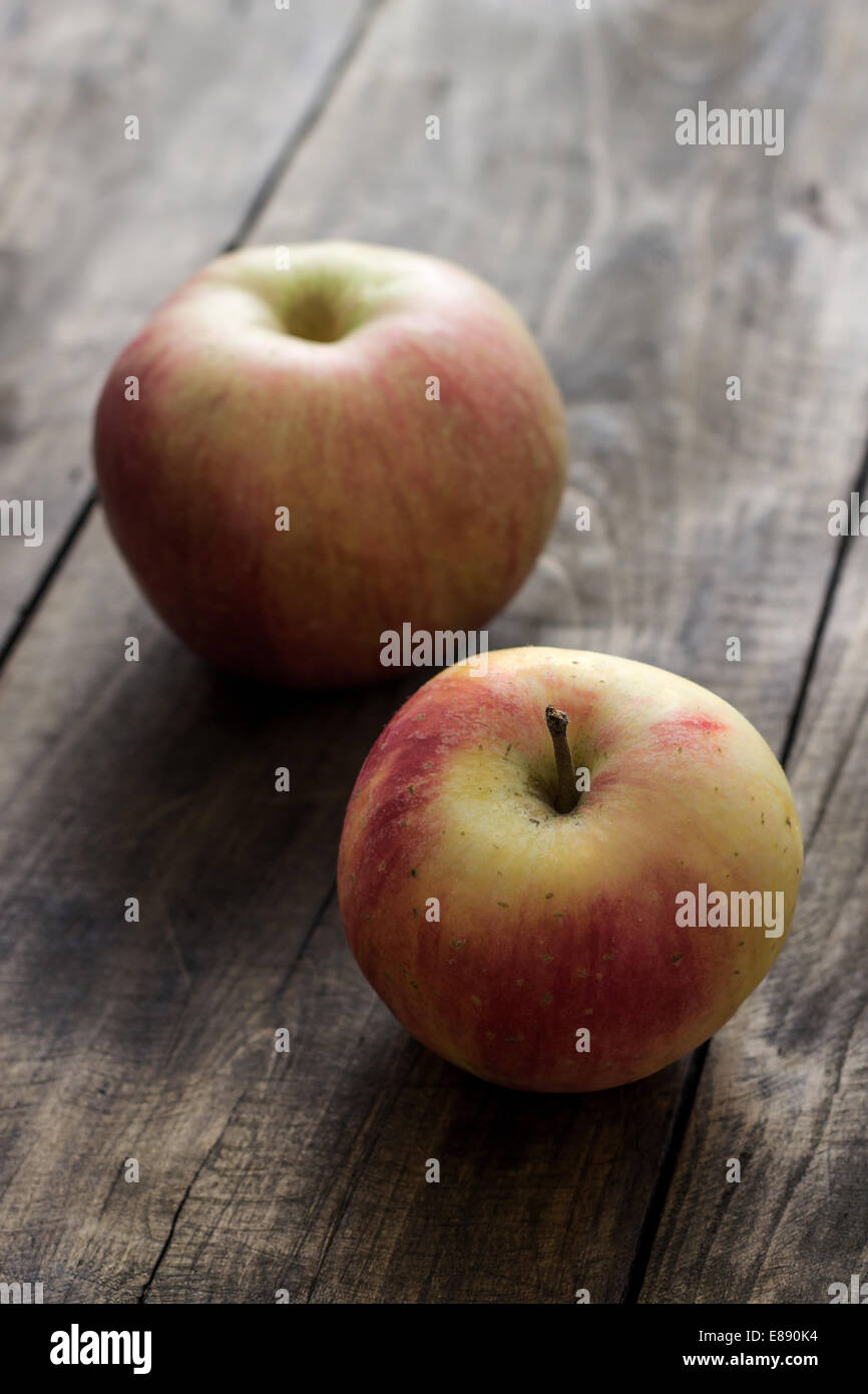 red apples on wooden table, close up Stock Photo - Alamy