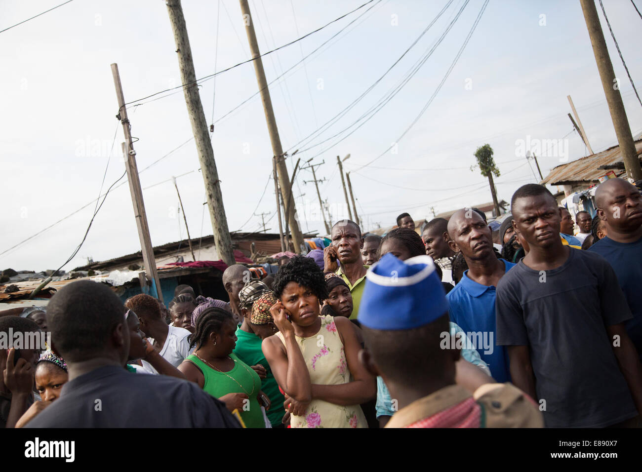 West Point residents wait at the edge of the quarantine. West Point is ...