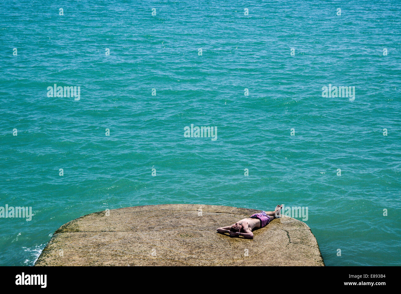 Sunbathing at the beach Stock Photo - Alamy