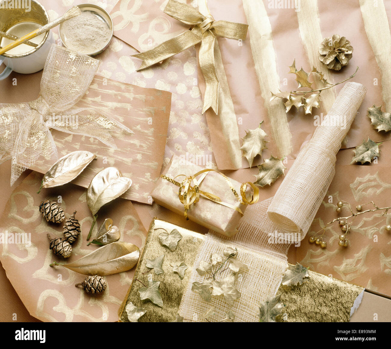 Close-up of materials for making Christmas crackers with gold painted ...