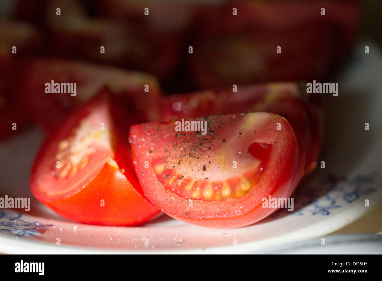 Tomatoes in plate cut hi-res stock photography and images - Alamy