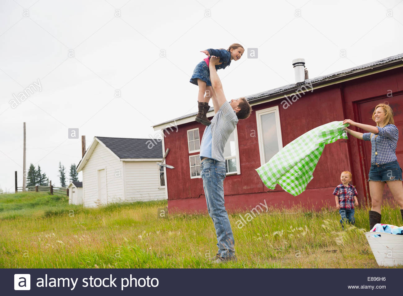 Father playing with children wife house hi-res stock photography and ...