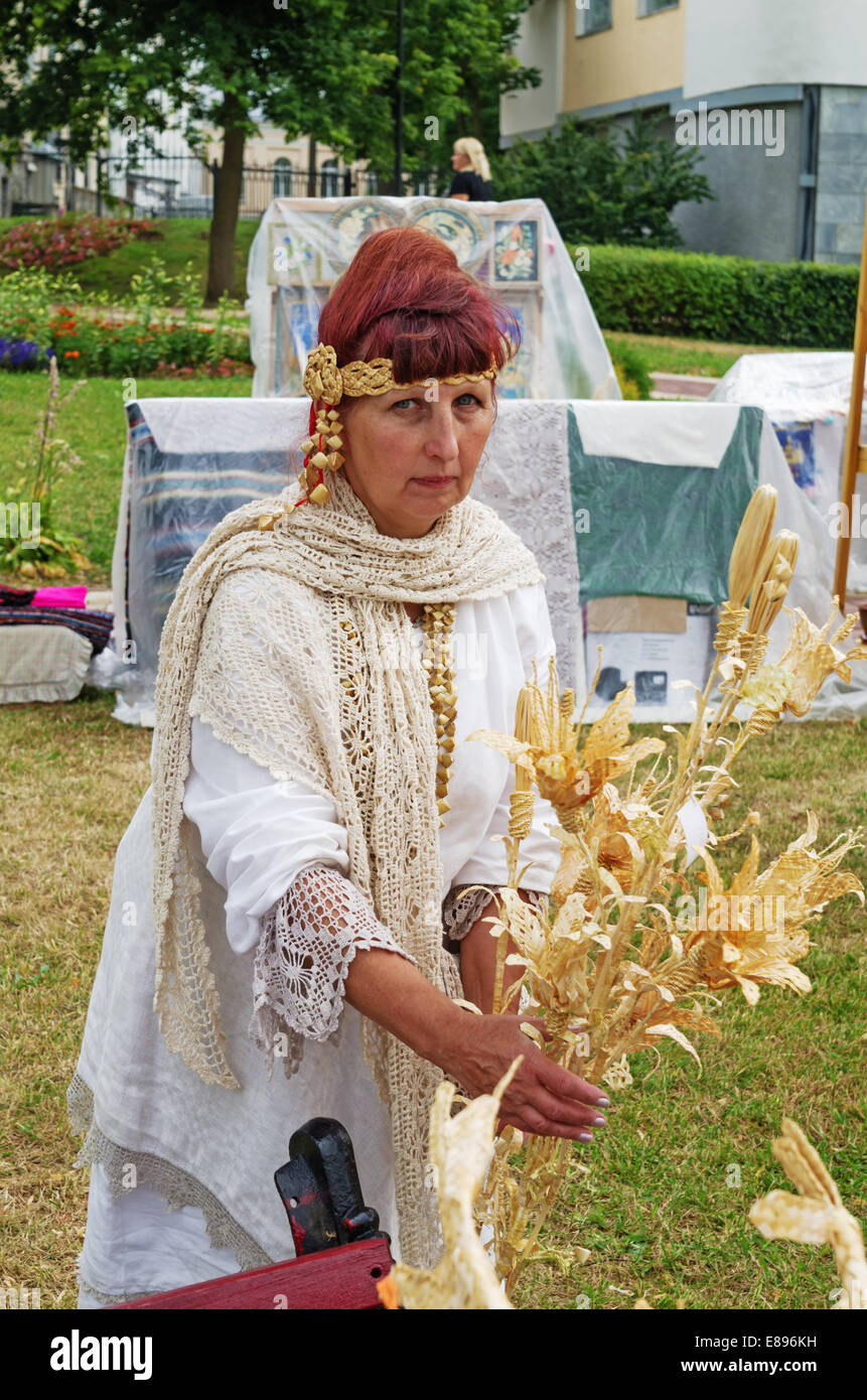 Street of the festival city. The folk master-woman Stock Photo - Alamy