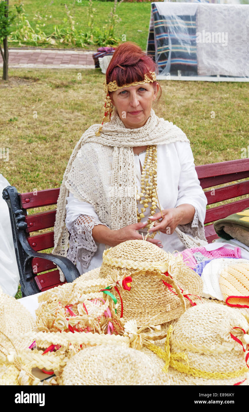 Street of the festival city. The folk master-woman Stock Photo - Alamy