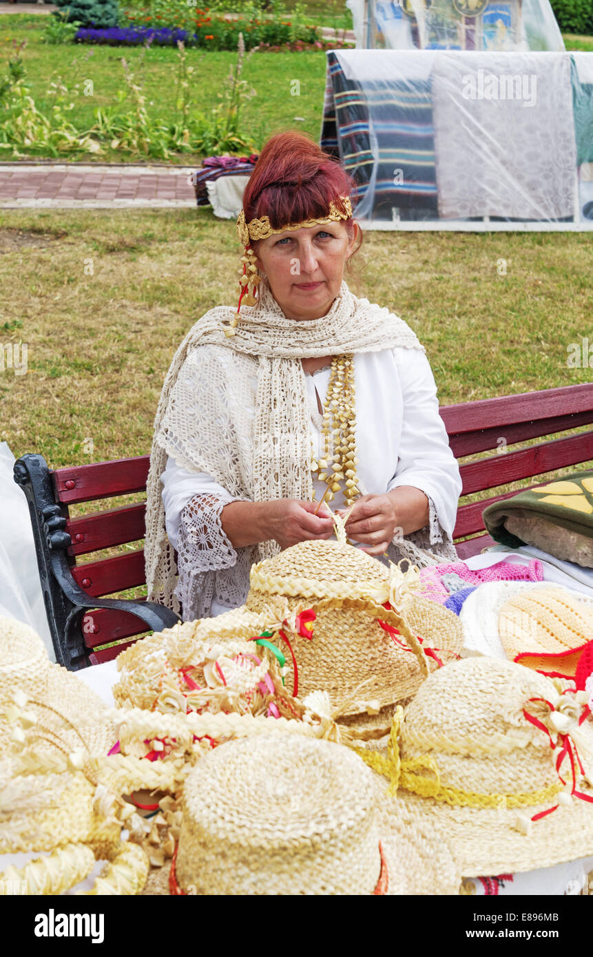 Street of the festival city. The folk master-woman Stock Photo - Alamy