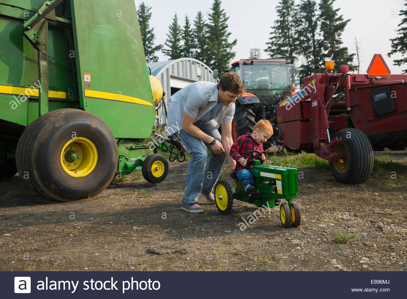 Father pushing him hi-res stock photography and images - Alamy