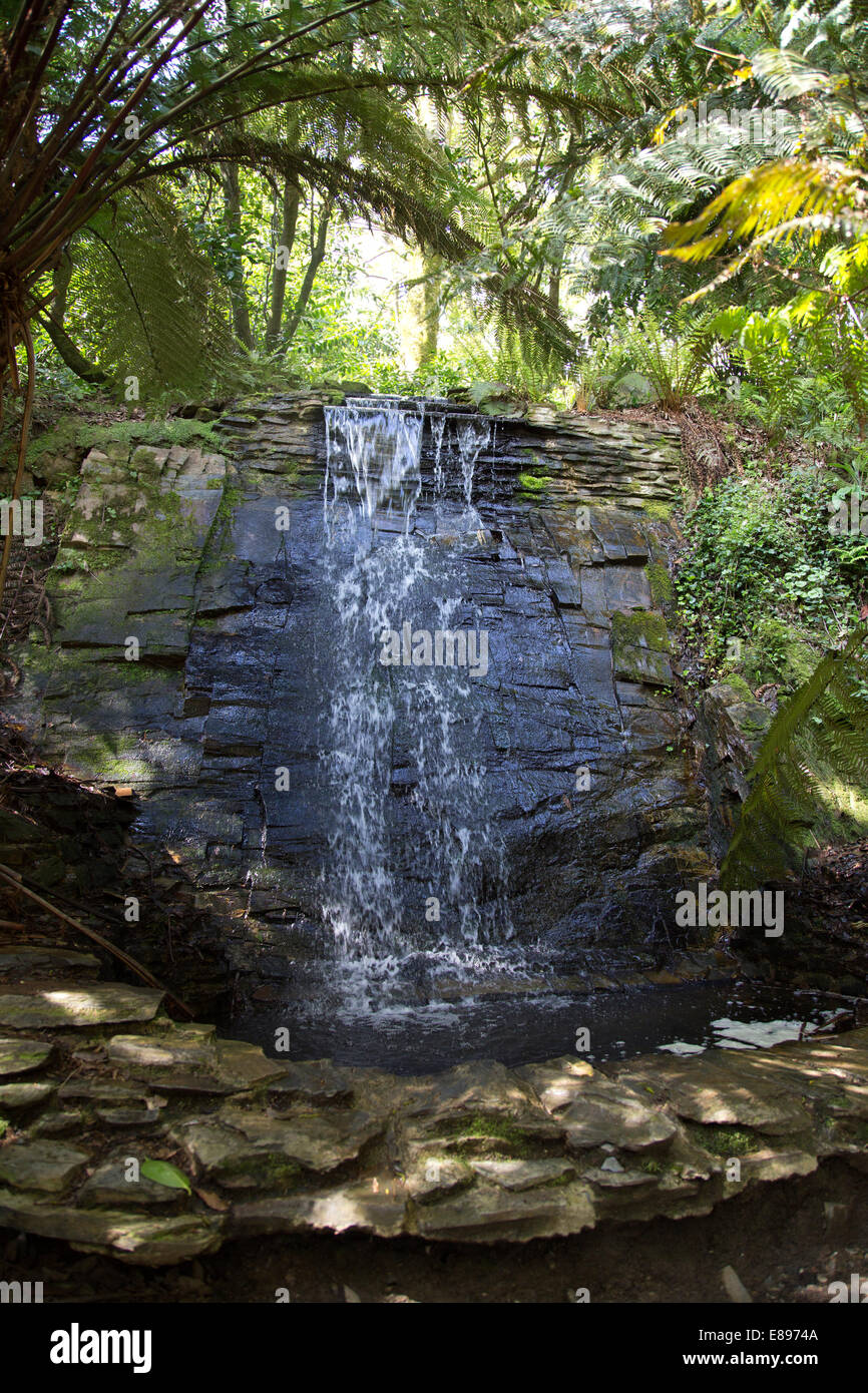 Water falls down into a small pool Stock Photo - Alamy