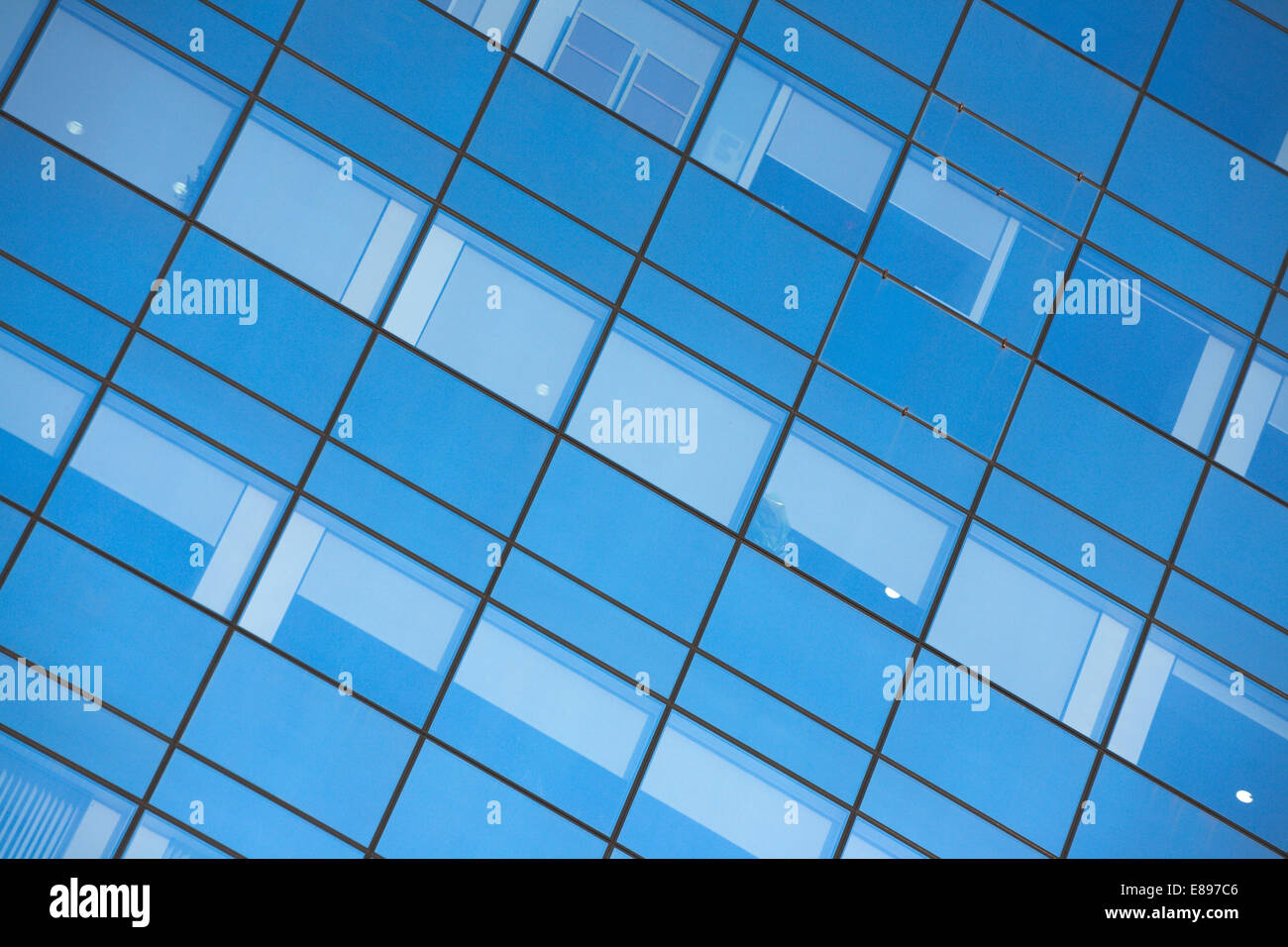 Close up of office building windows with blue glass Stock Photo - Alamy