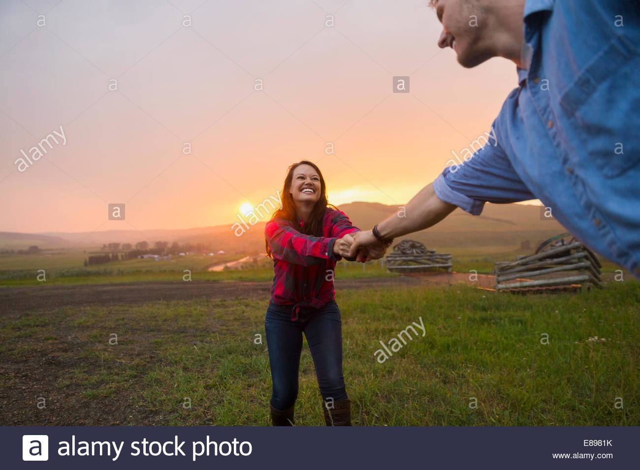 Man pulling his wife hi-res stock photography and images - Alamy