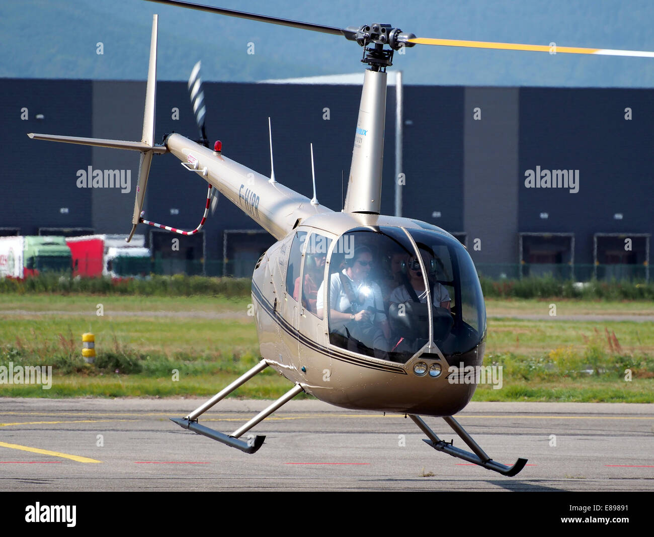 F-HJPR is a Robinson R44 Raven II helicopter taking off from Colmar ...