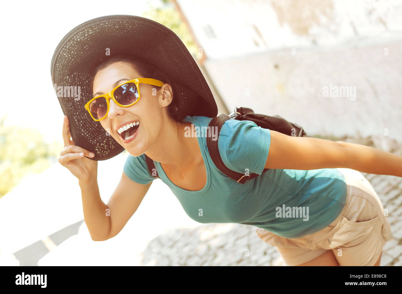 Girl laughs while standing in an awkward position Stock Photo - Alamy Girl laughs while standing in an awkward position Stock Photo - Alamy