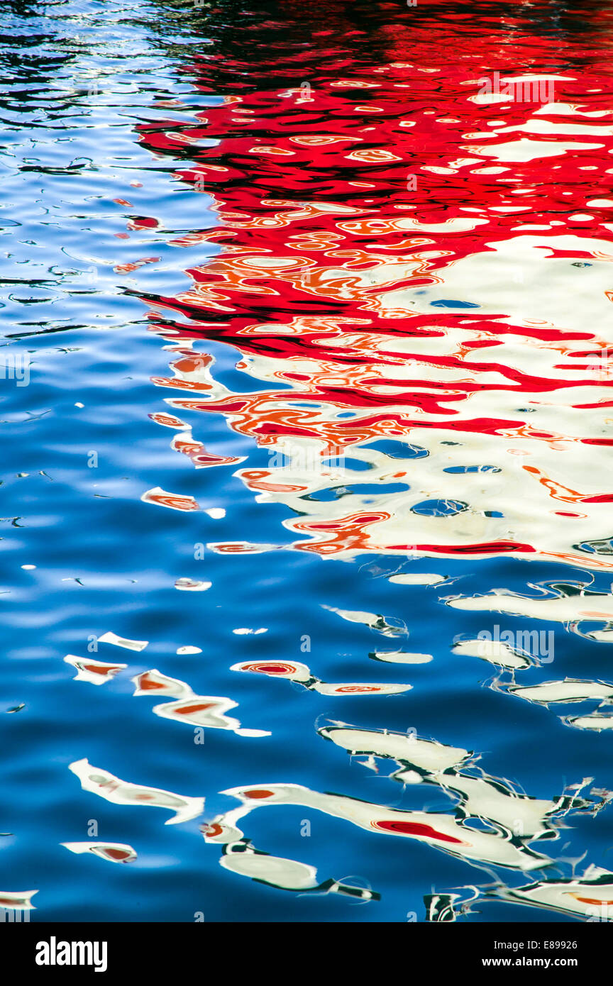 Reflection of red boat hull in San Francisco Bay, California, USA Stock ...