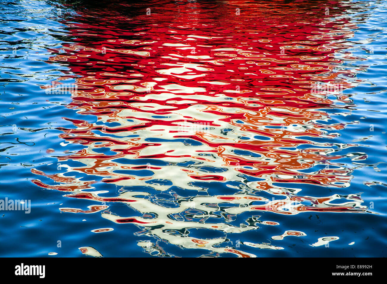 Reflection of red boat hull in San Francisco Bay, California, USA Stock ...
