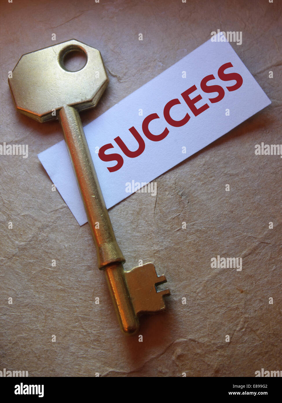Success label and golden key close up Stock Photo - Alamy