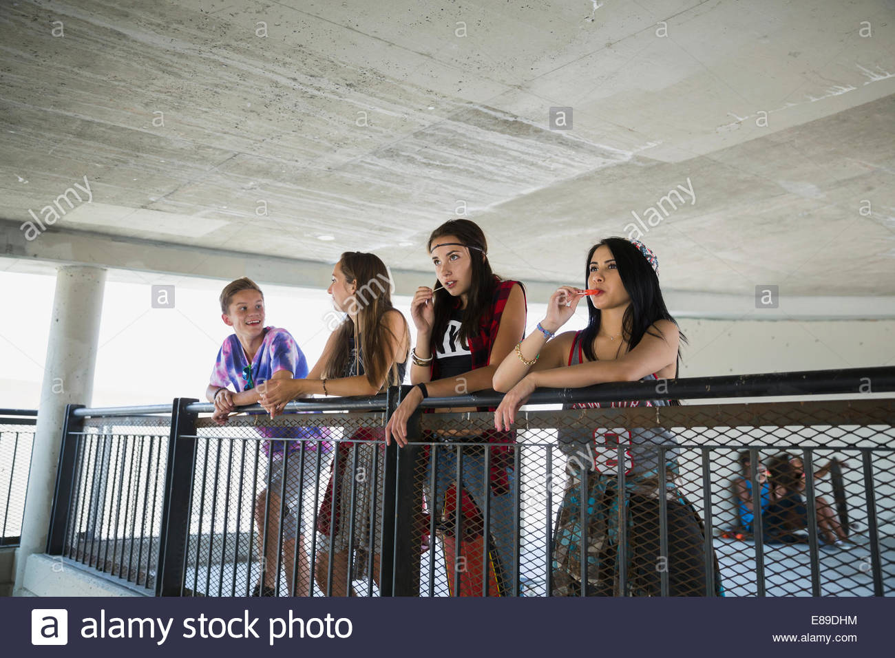 Teenagers leaning on railing hi-res stock photography and images - Alamy