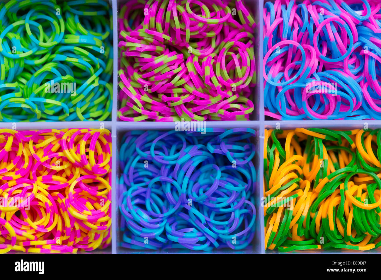 Brightly coloured loom bands in a box Stock Photo - Alamy