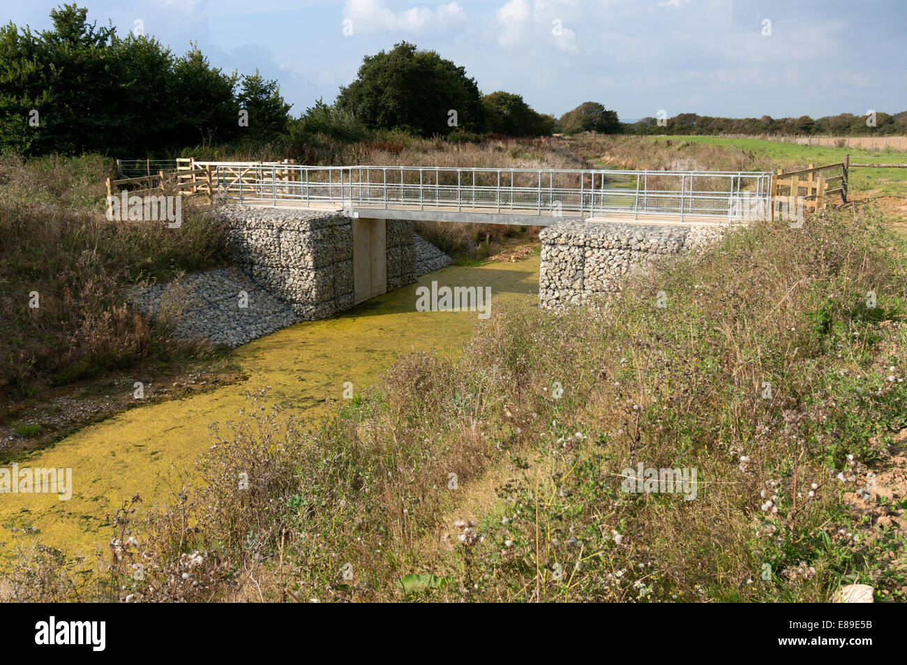Newly built bridge over irrigation/drainage channel on farmland ...