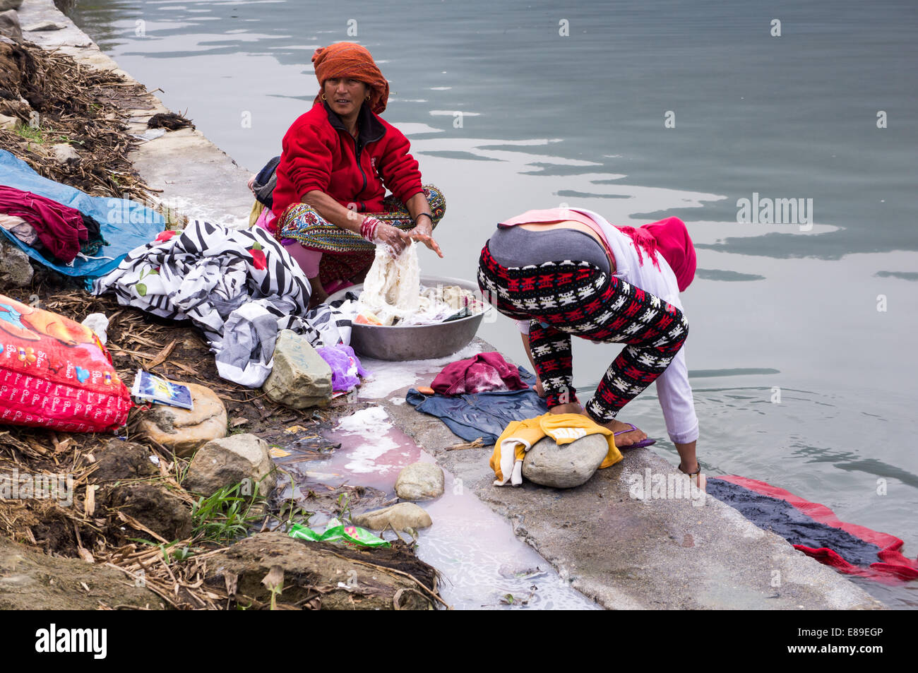 Girl washing clothes in river hi-res stock photography and images - Alamy