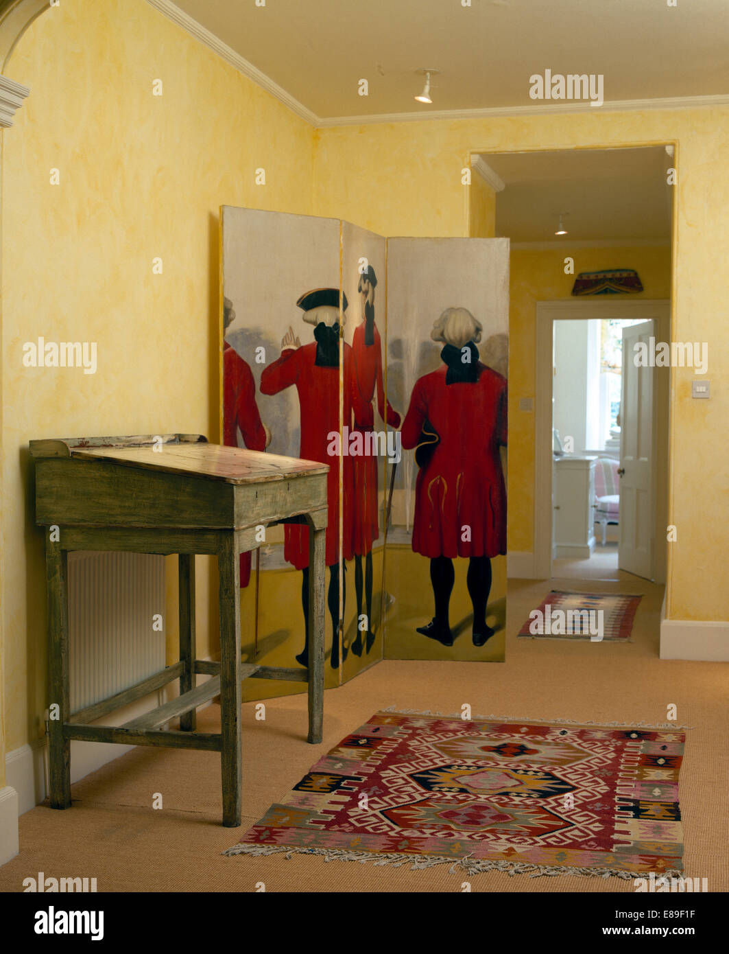Folding screen with painted Georgian figures on landing with lime ...