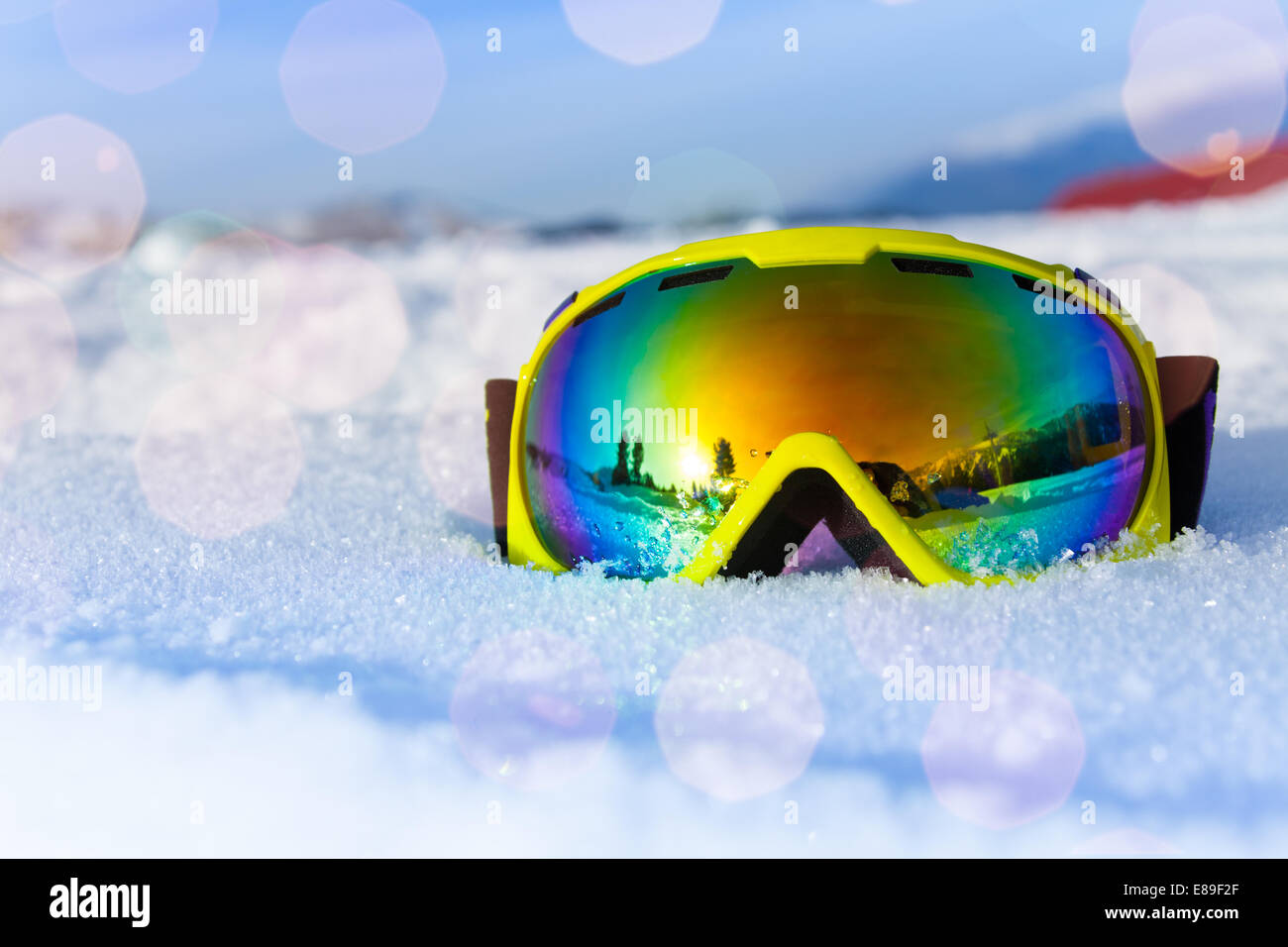 View of yellow ski mask on white icy snow Stock Photo - Alamy