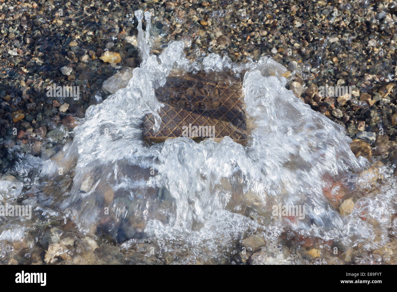 Water leak creating a huge puddle at the side of a road between Ashwell ...