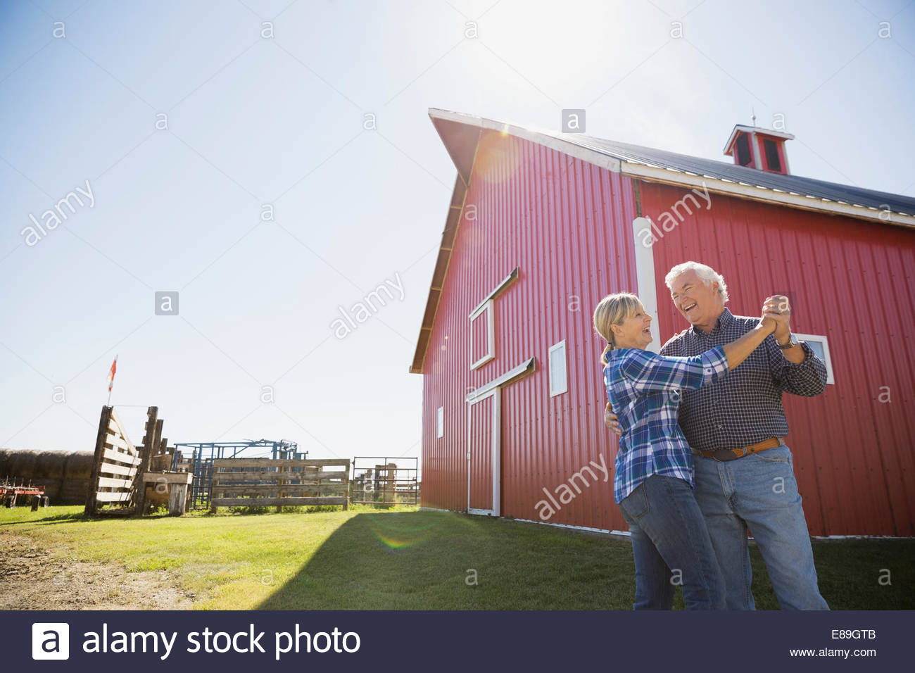 Playful couple smiling outdoors hi-res stock photography and images - Alamy