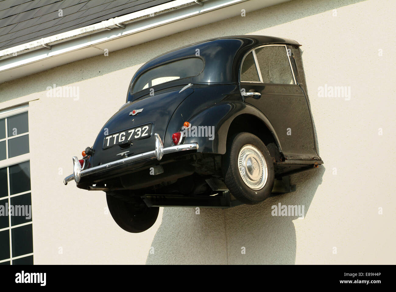 An artwork depicting a car embedded in a wall Stock Photo - Alamy