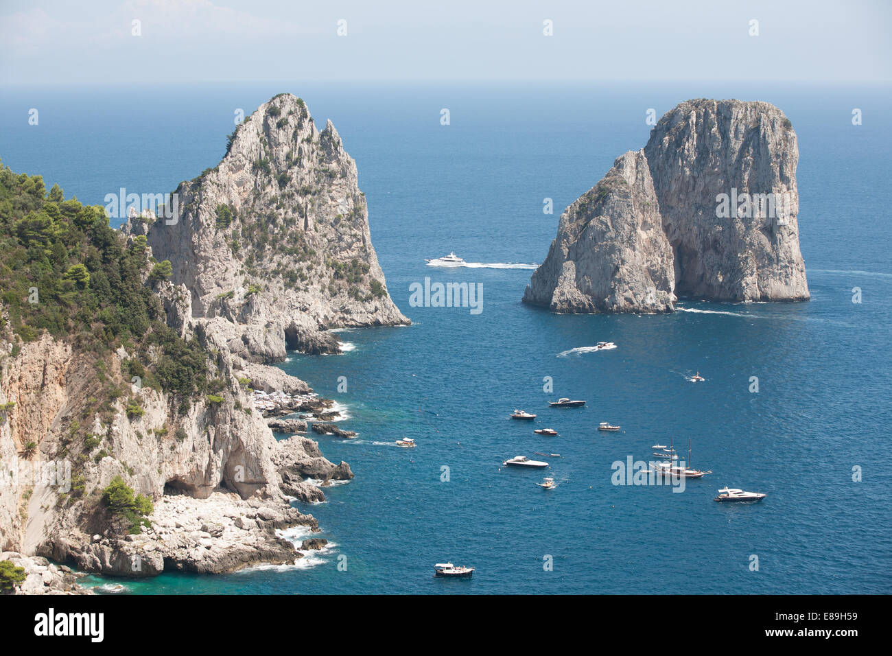 The Faraglioni, three towering rock formations off the Mediterranean ...