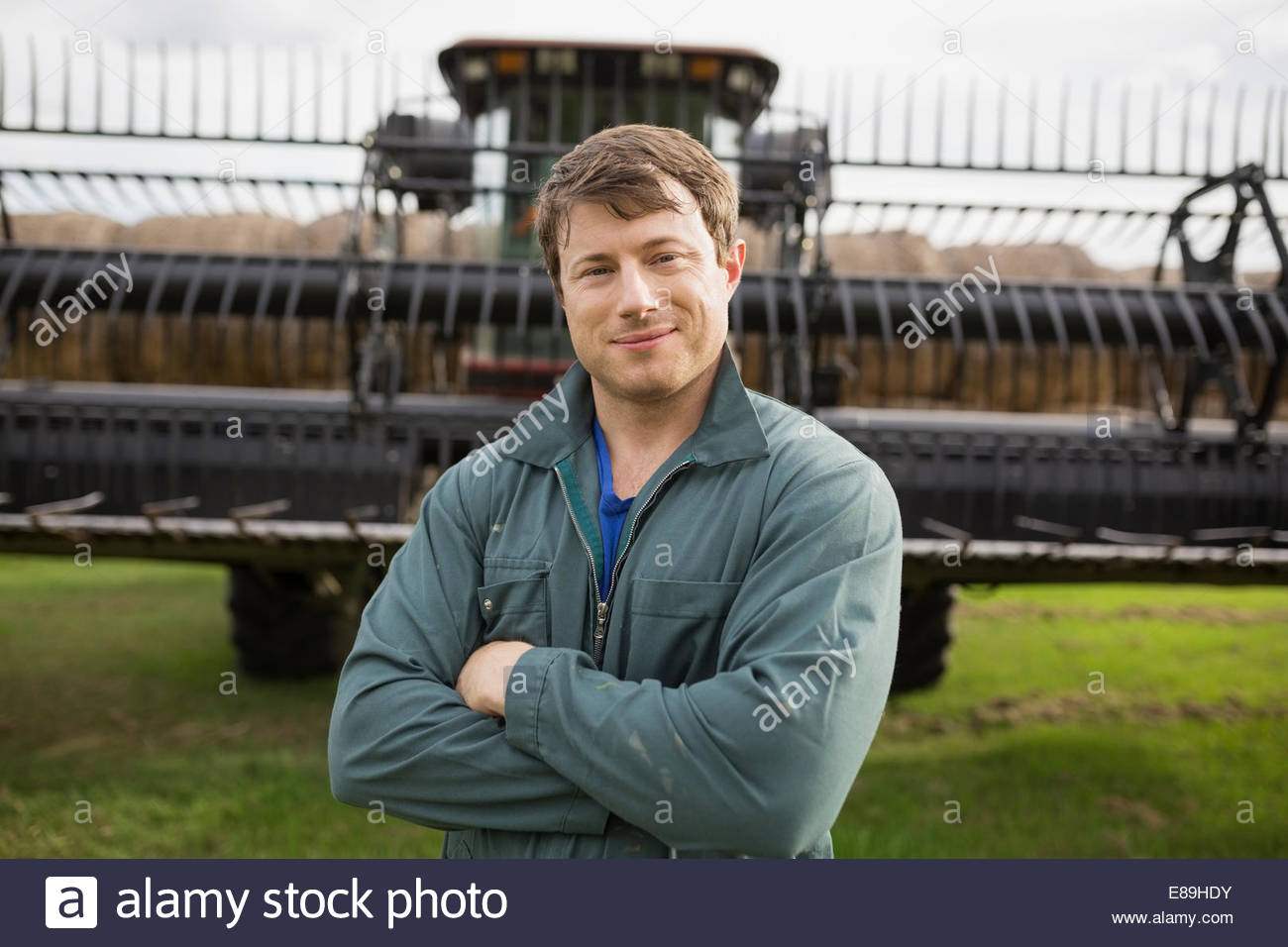 Farmer in front combine harvester hi-res stock photography and images ...