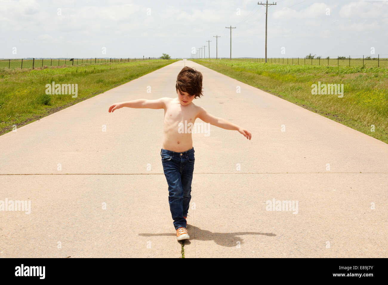 Boy Walking Along Sidewalk Stock Photos & Boy Walking Along Sidewalk ...