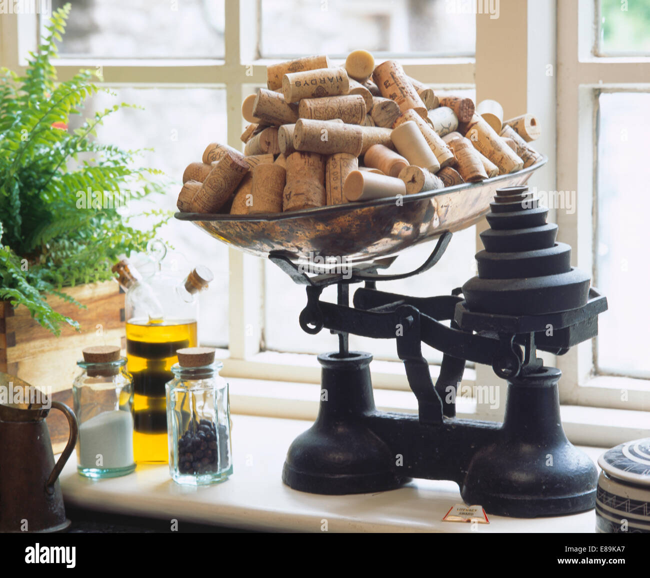 Close-up of corks in old black metal scales on windowsill Stock Photo ...