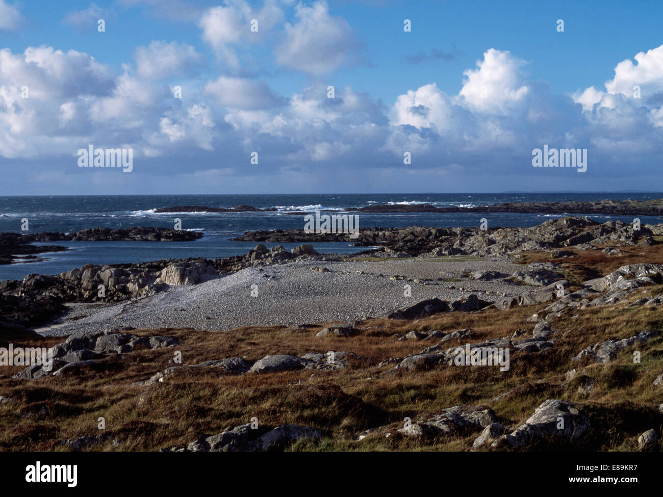 White clouds in blue sky above the sea off the coast of Scotland Stock ...