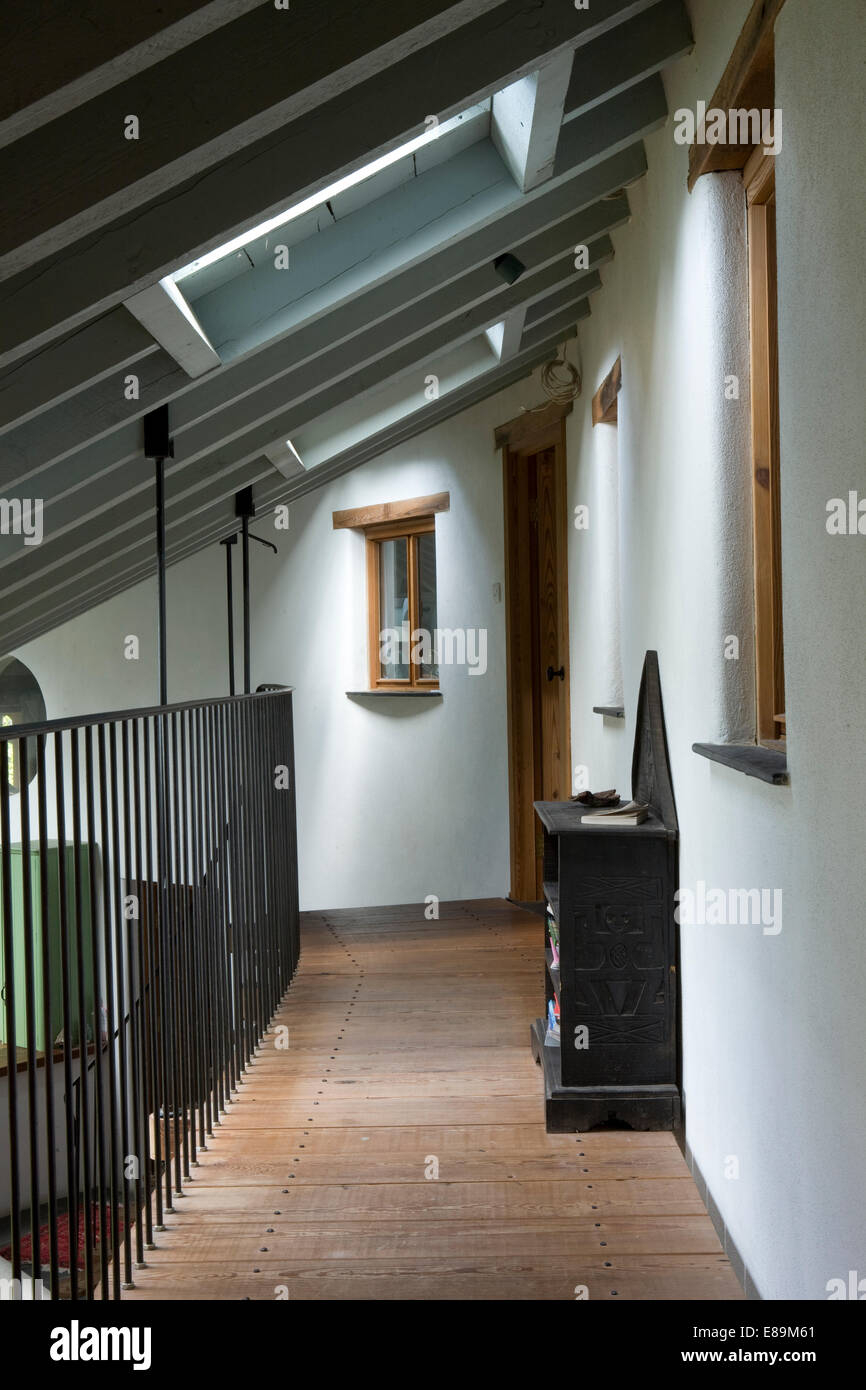 Modern country landing with pitched ceiling and wooden floor Stock ...